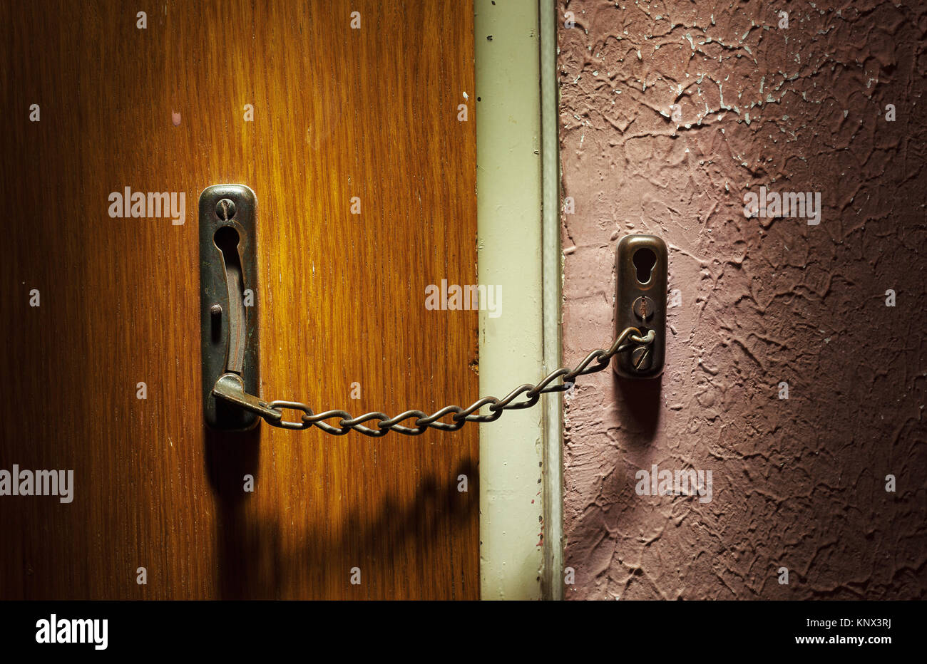 Old wooden doors with chain lock, safety conception Stock Photo - Alamy