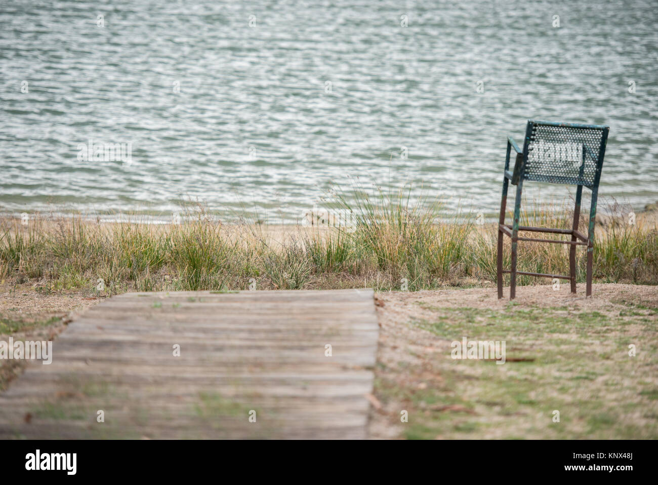 A rickety metal chair on the shore of the reservoir of Proserpina ...