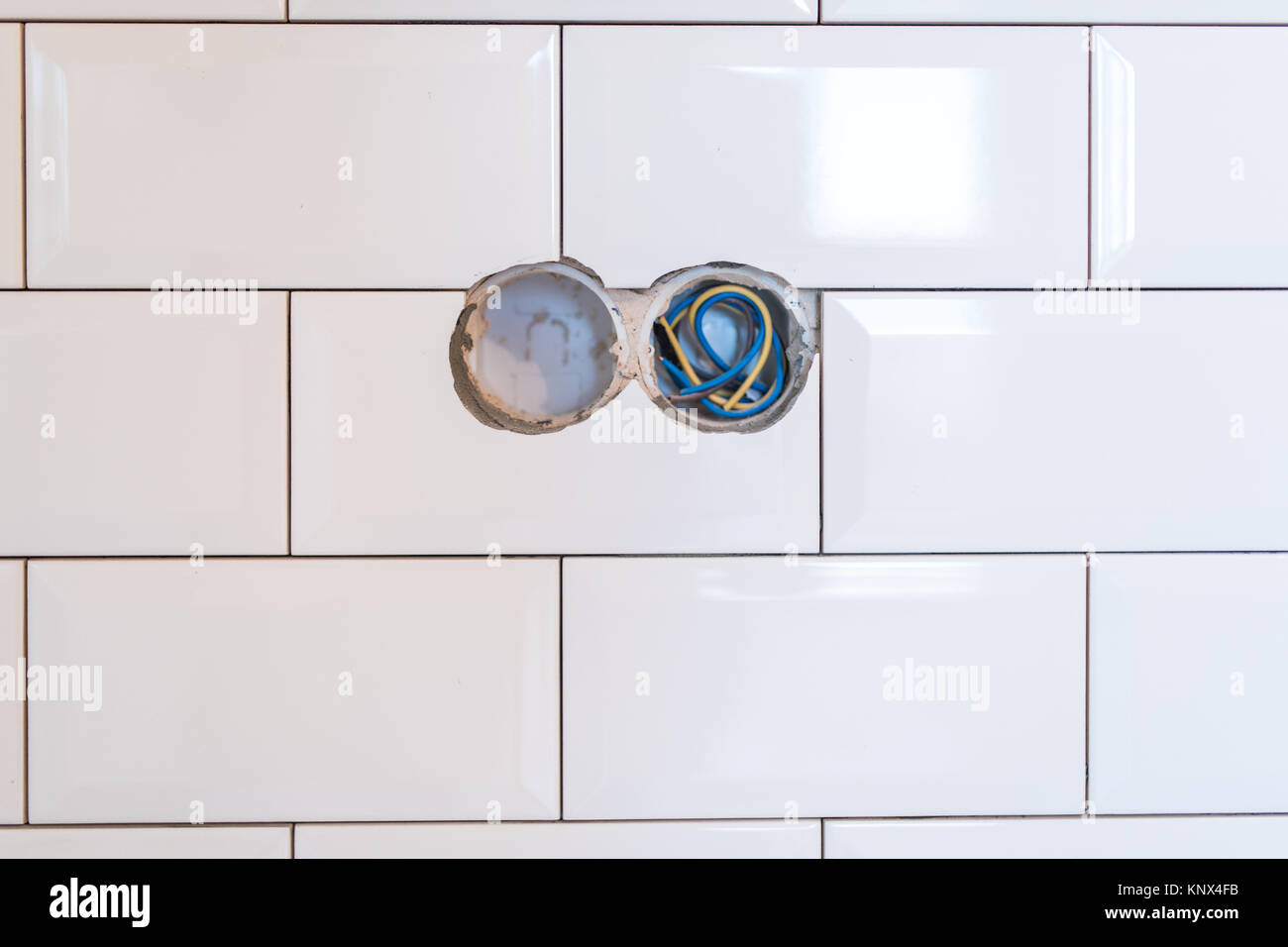 Stylish trendy white ceramic tile with a chamfer on the kitchen wall ...