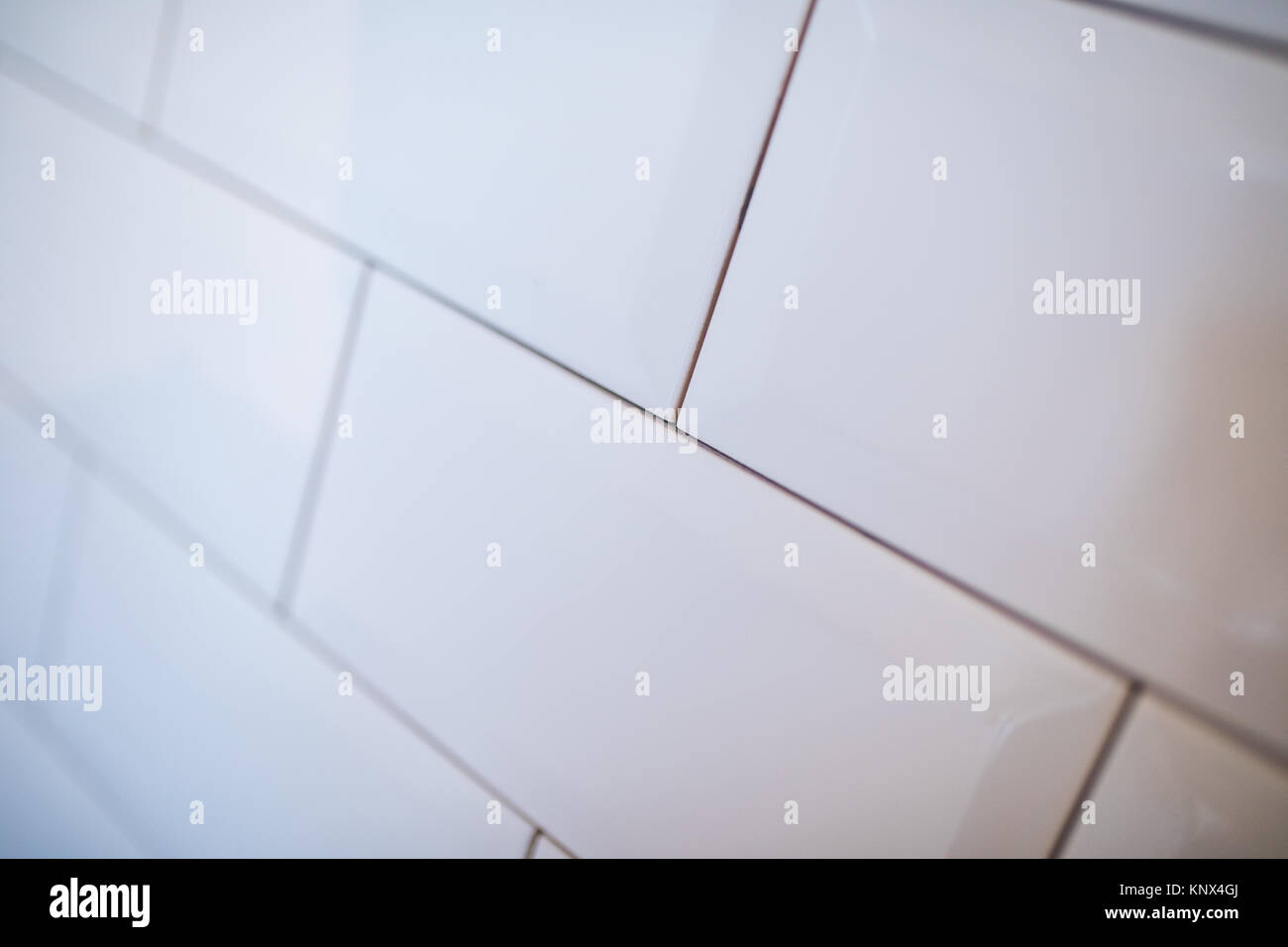 Stylish trendy white ceramic tile with chamfer on the kitchen wall ...