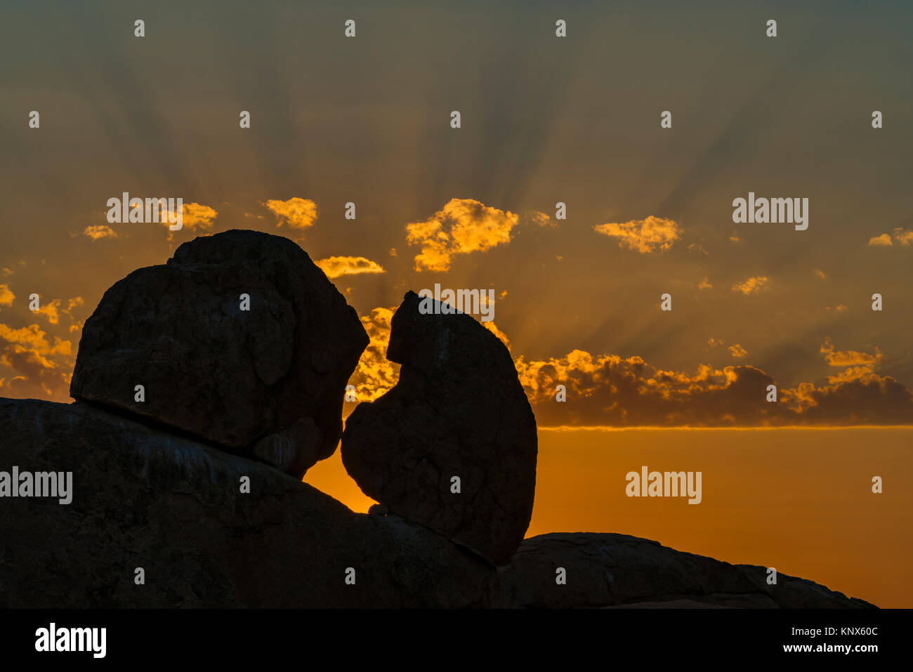 Rocks at sunset Stock Photo - Alamy