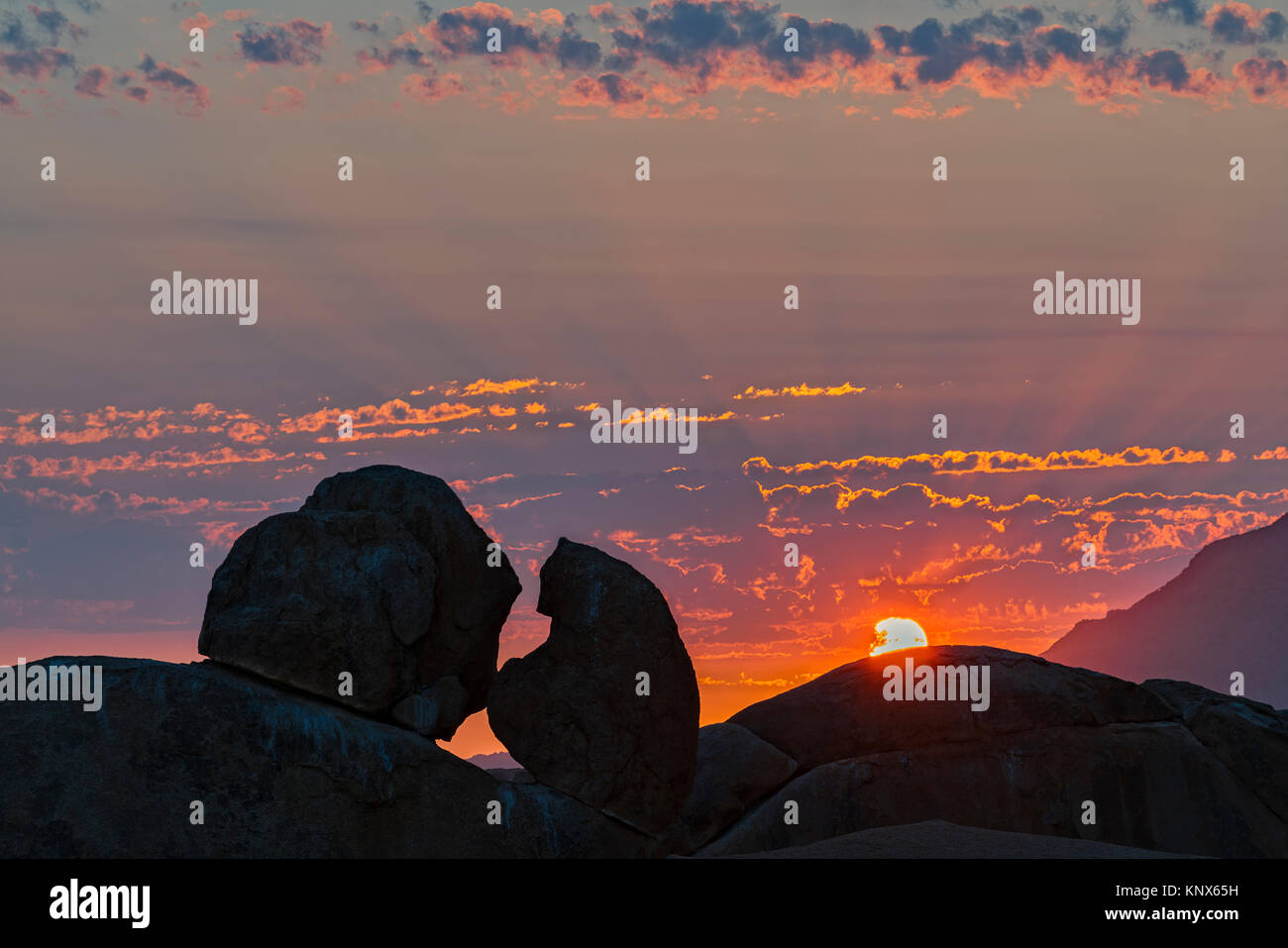 Rocks at sunset Stock Photo - Alamy