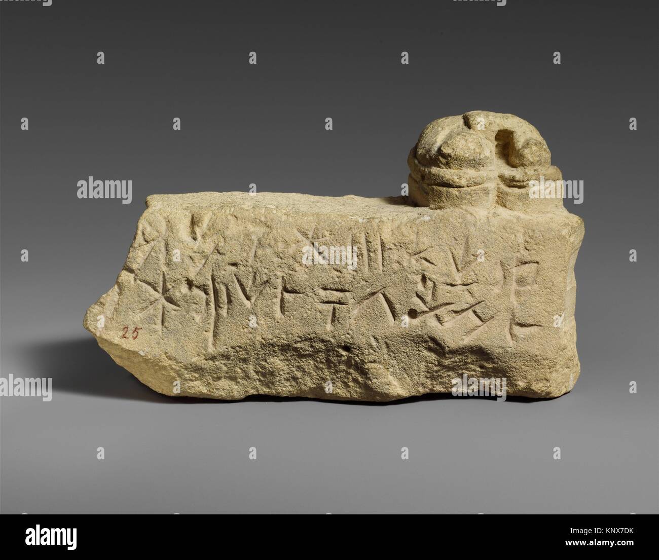 Limestone plinth with the feet of a female statuette (?). Period: Early ...