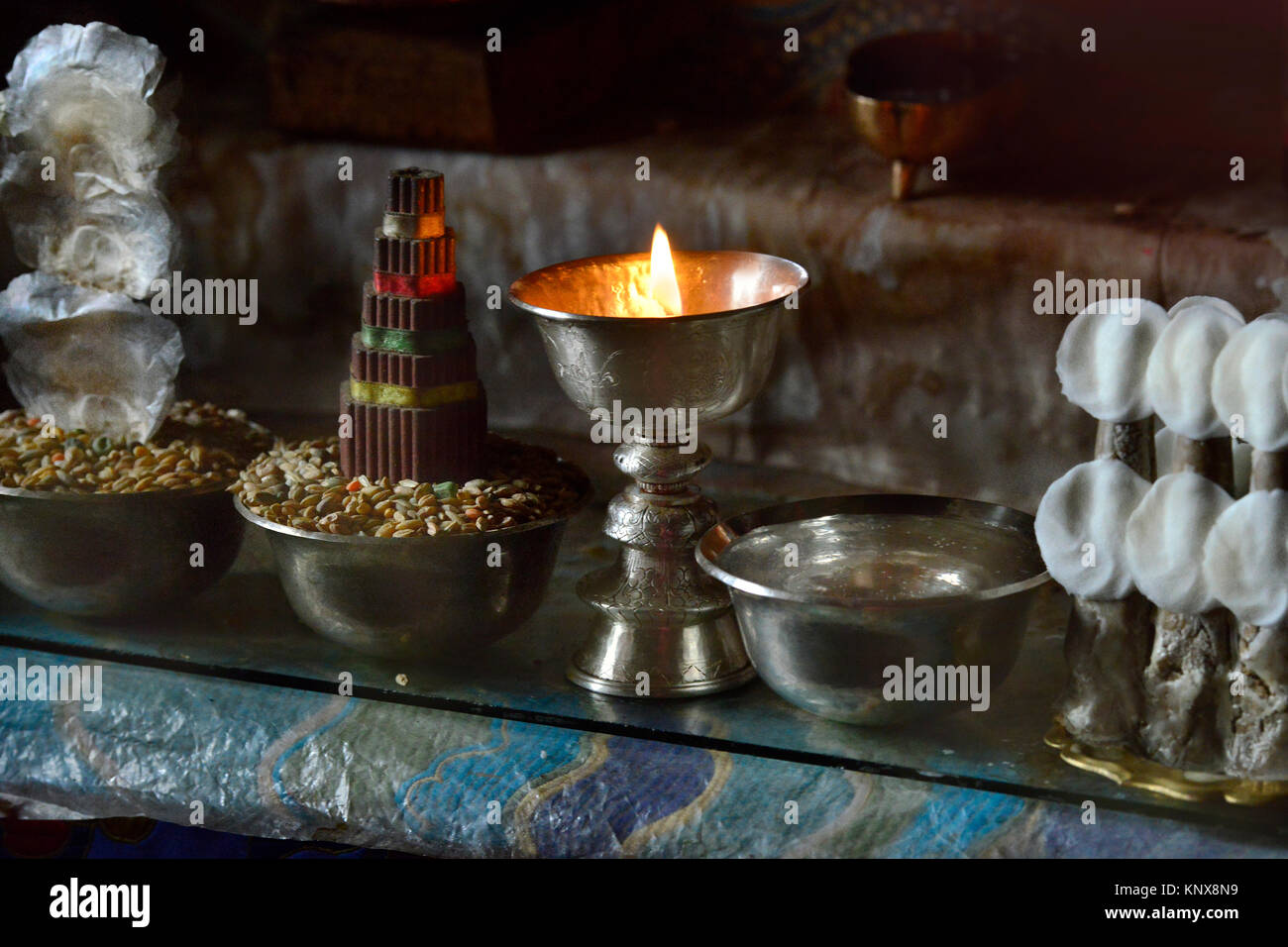 Buddhist oil lamp with lights and ritual offerings of monks Stock Photo ...