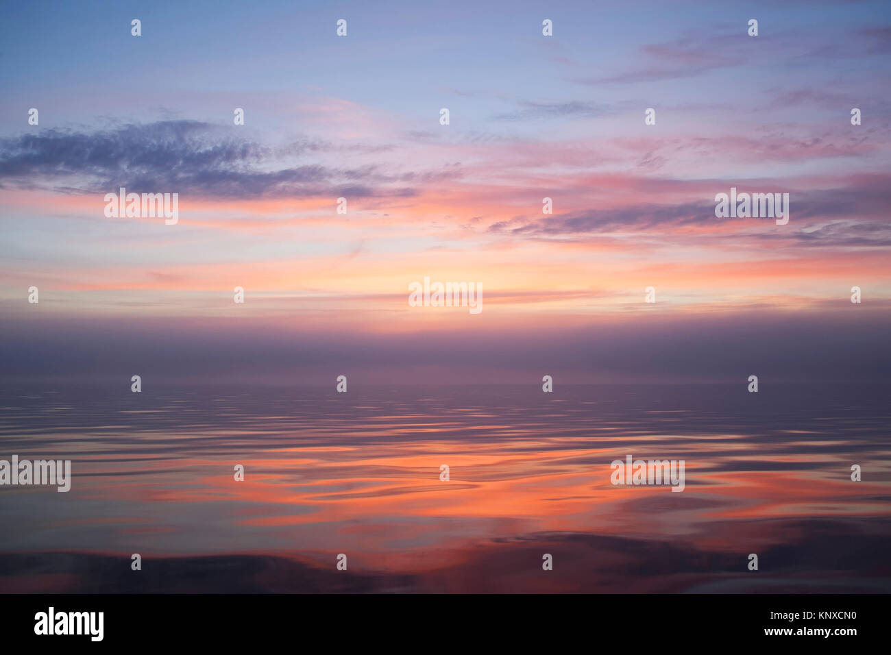 Sunset in pink, yellow and blue colors of the sea Stock Photo - Alamy