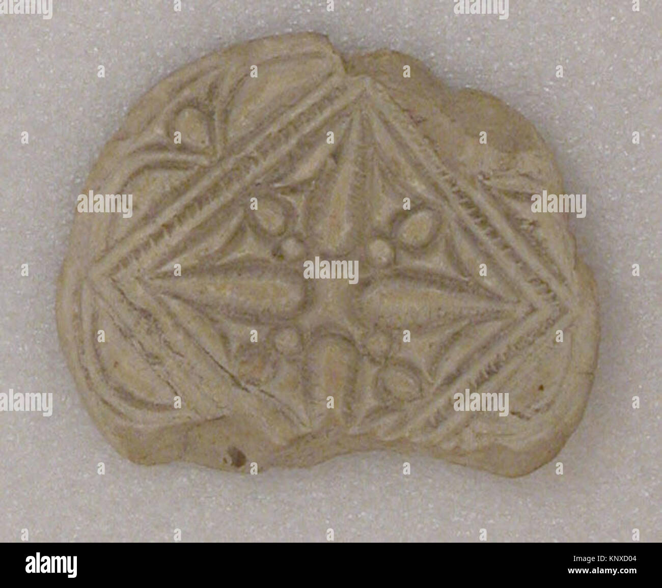 This MET bread seal is a stamped object used to mark bread for ...
