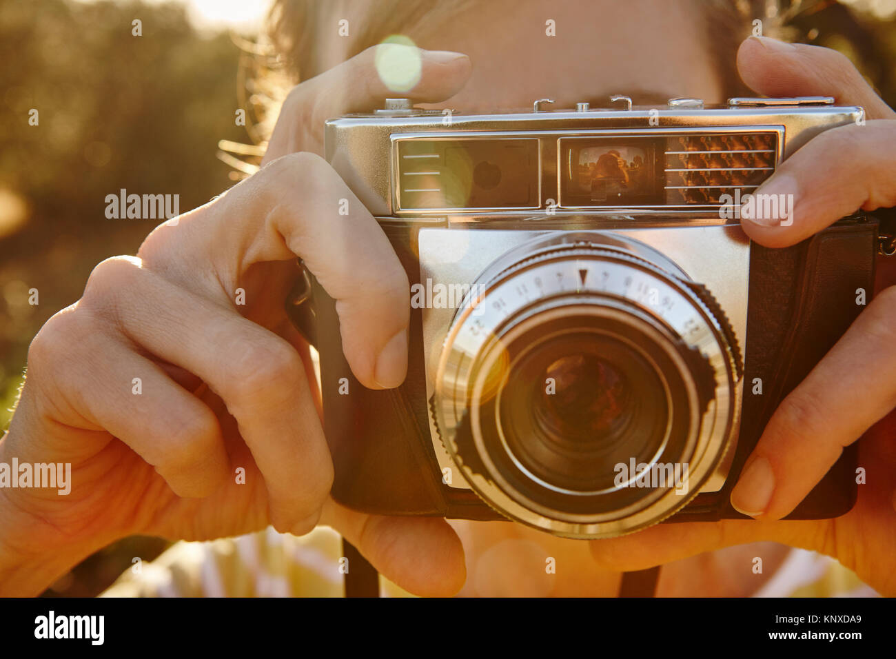 Woman taking pictures with vintage camera. Travel background ...