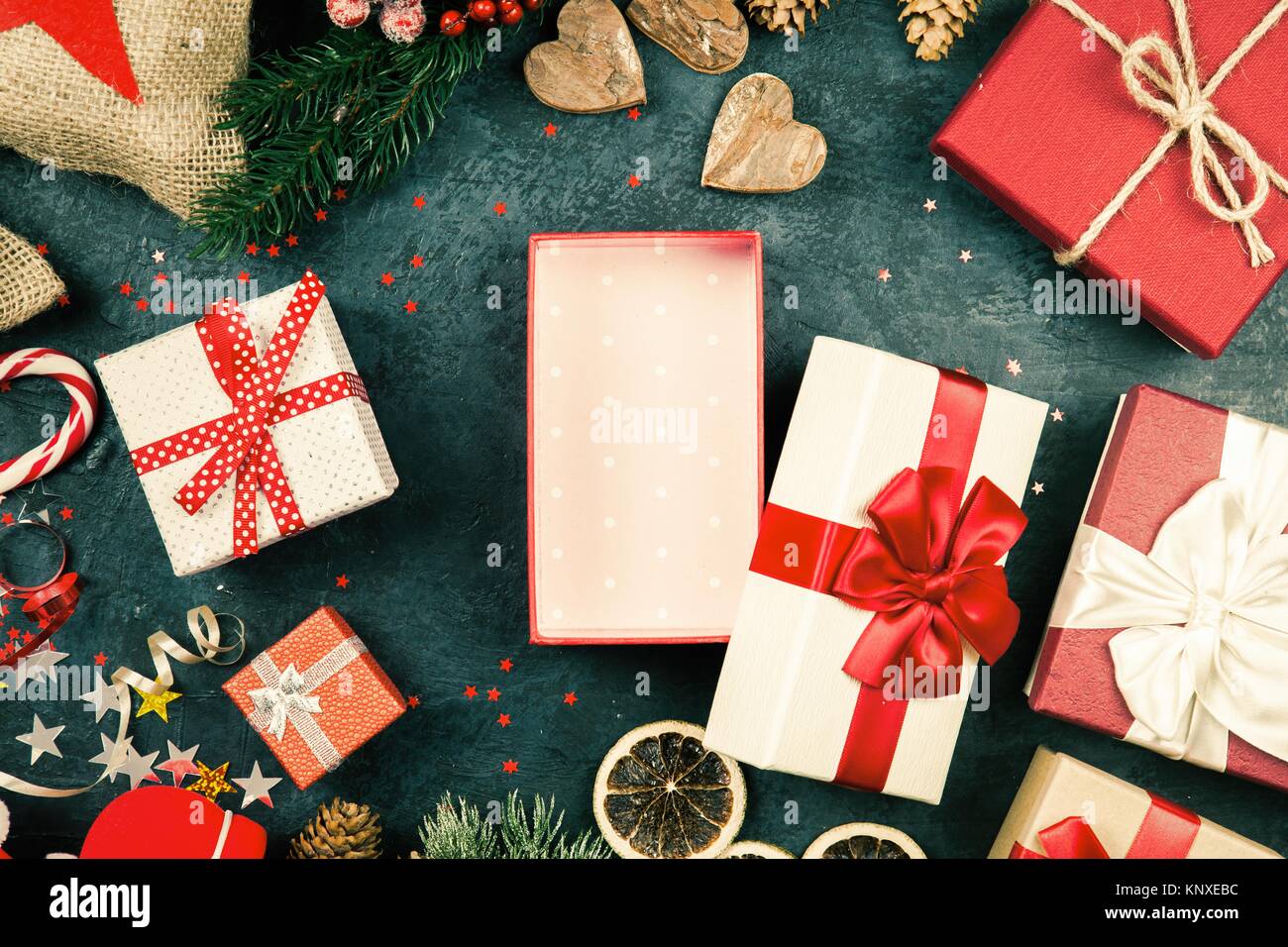 Lots of Christmas presents on dark background Stock Photo - Alamy