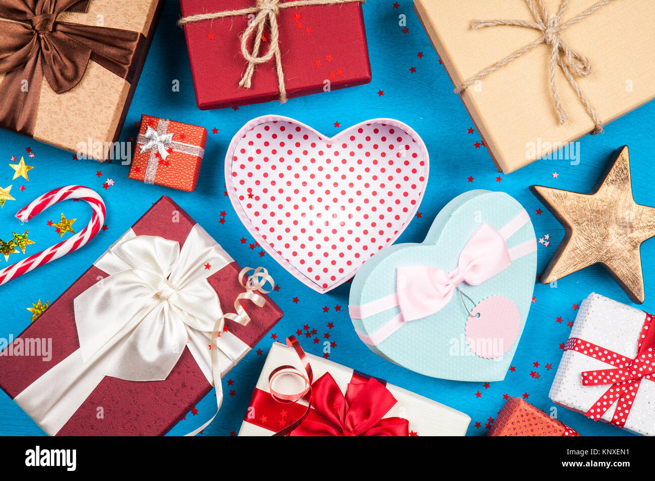 Lots of Christmas presents on blue background Stock Photo - Alamy