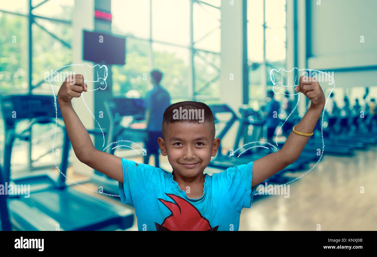 Asian strong children on Abstract blurred photo of fitness gym ...