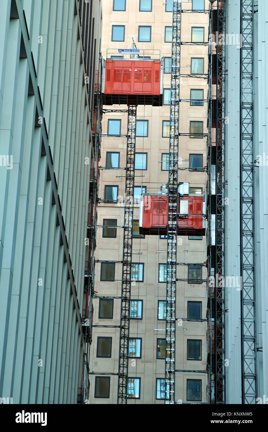 Temporary access lifts for builders on a large construction site in ...