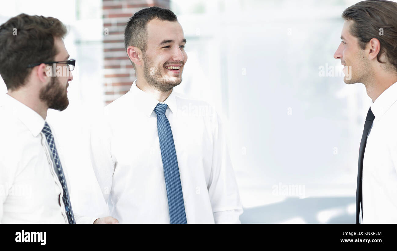 employees are talking ,standing in the office Stock Photo - Alamy