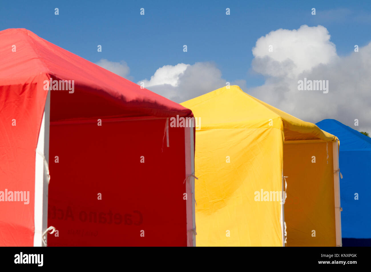Colored tents in the beach Stock Photo - Alamy