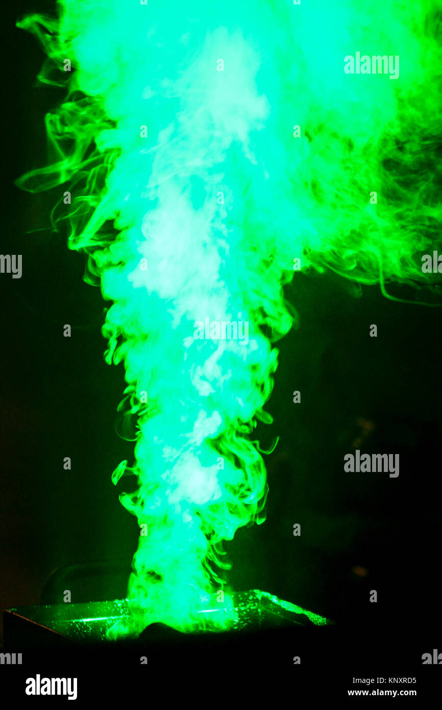 A green smoke generated by a magic potion Stock Photo - Alamy
