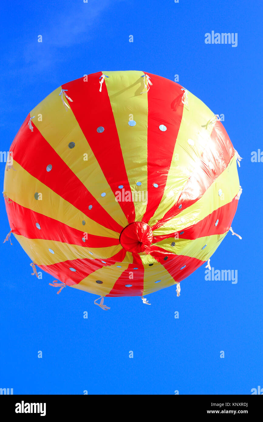 A striped balloon flies in the sky Stock Photo - Alamy