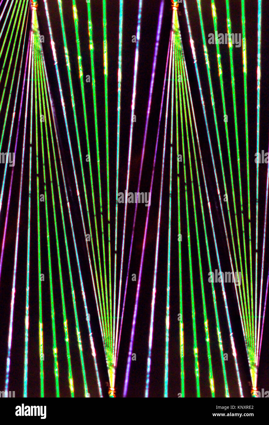 Beams of light of many color generated by a projector Stock Photo - Alamy