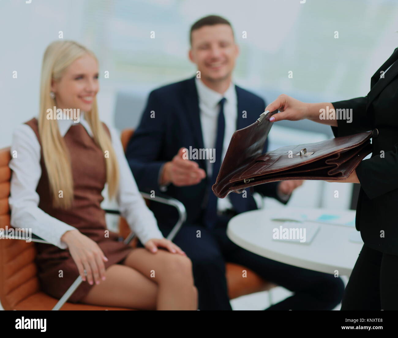 Business woman holding a briefcase Stock Photo - Alamy