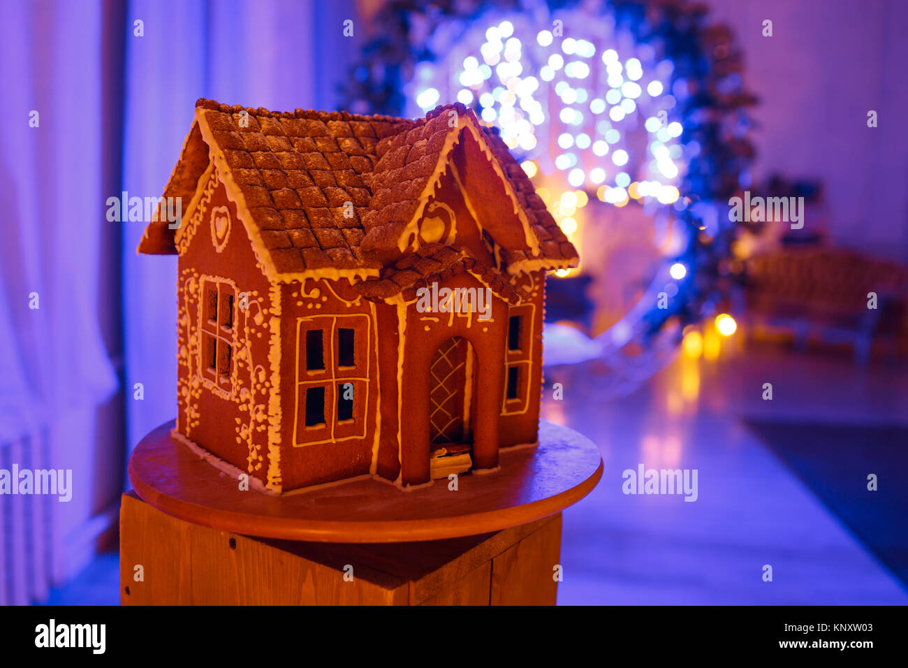 Gingerbread house. European Christmas holiday traditions. Garland blue ...
