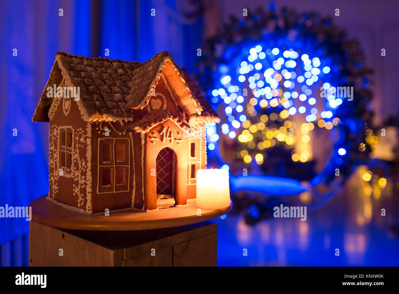 Gingerbread house. European Christmas holiday traditions. Garland blue ...