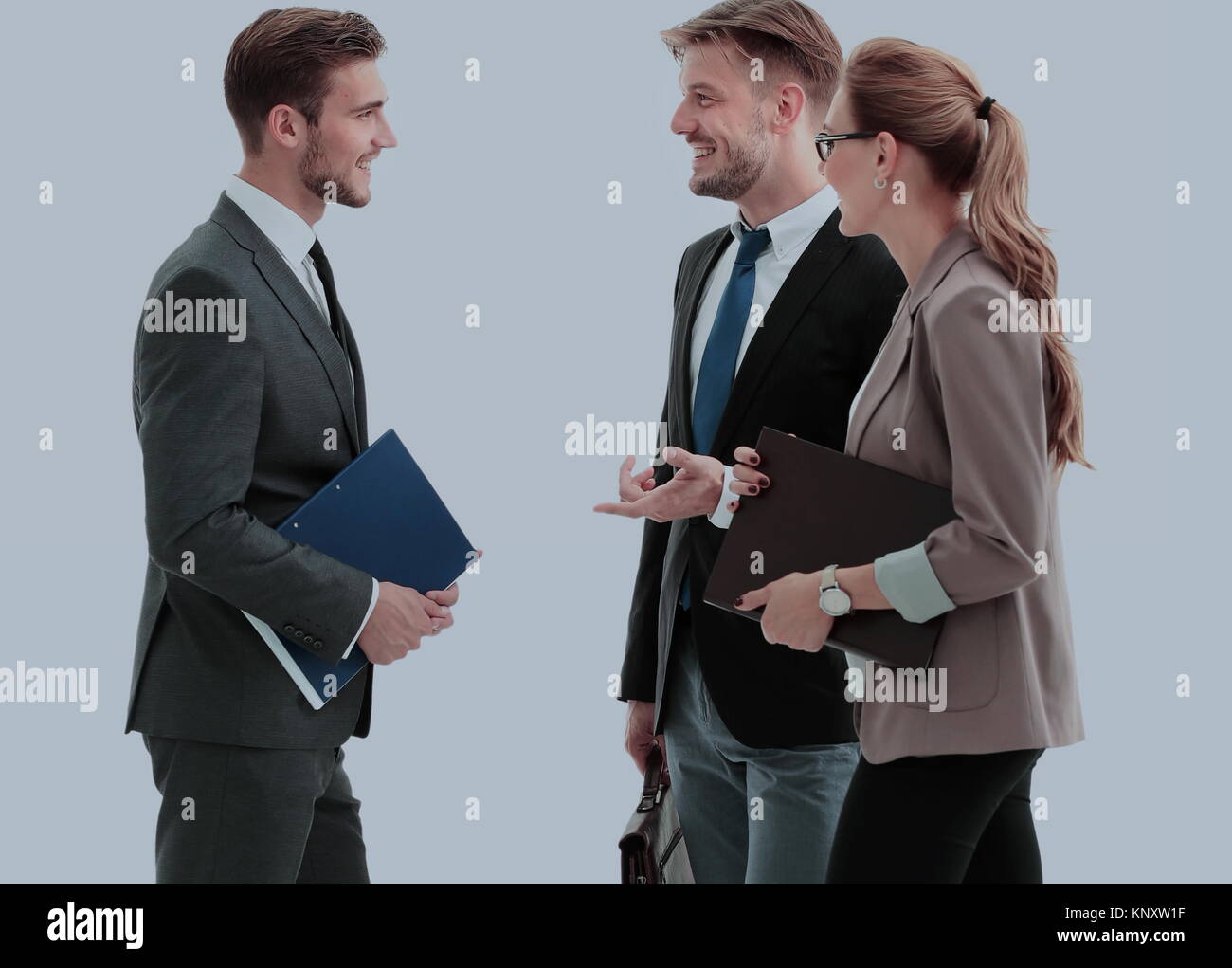 Three successful business person discussing Stock Photo - Alamy