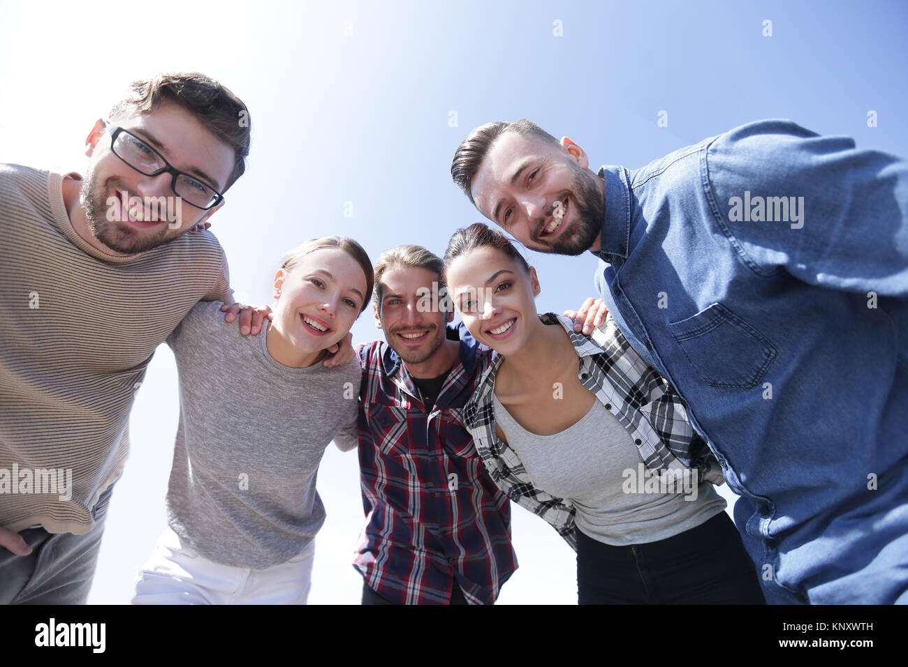 bottom view.team of friends looking at the camera Stock Photo - Alamy