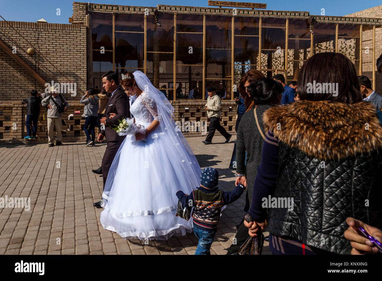 A Young Uzbek Couple Walk Through The Streets Of Khiva After Getting ...
