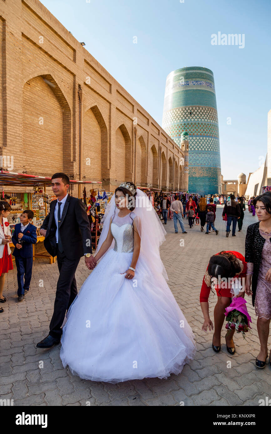 A Young Uzbek Couple Walk Through The Streets Of Khiva After Getting ...