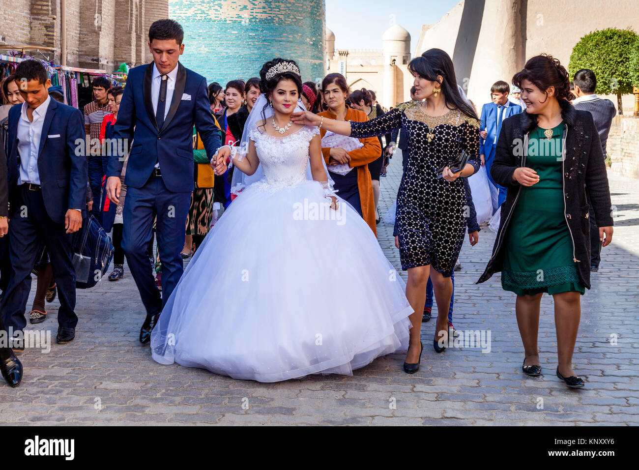 A Young Uzbek Couple Walk Through The Streets Of Khiva After Getting ...