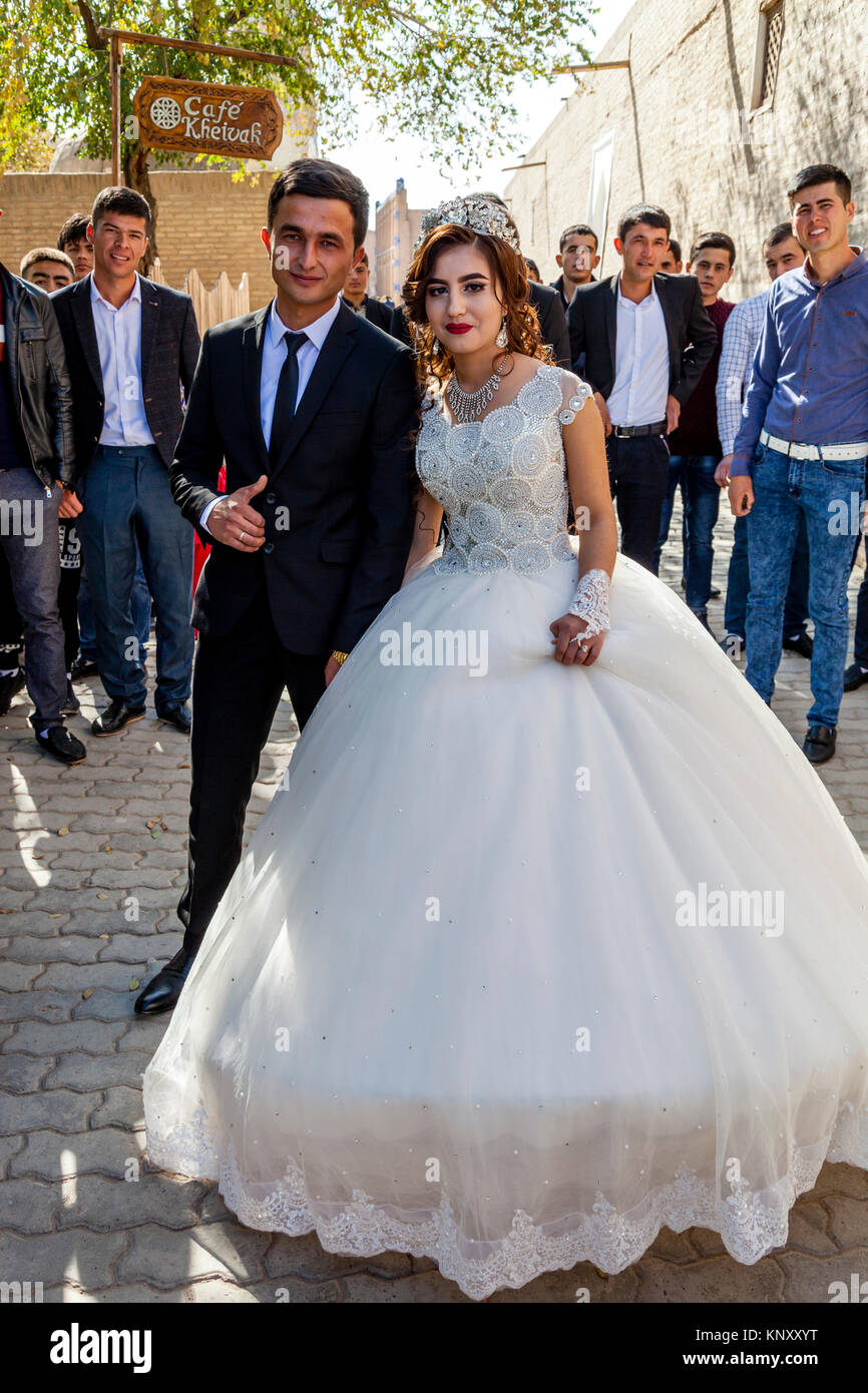A Young Uzbek Couple Walk Through The Streets Of Khiva After Getting ...