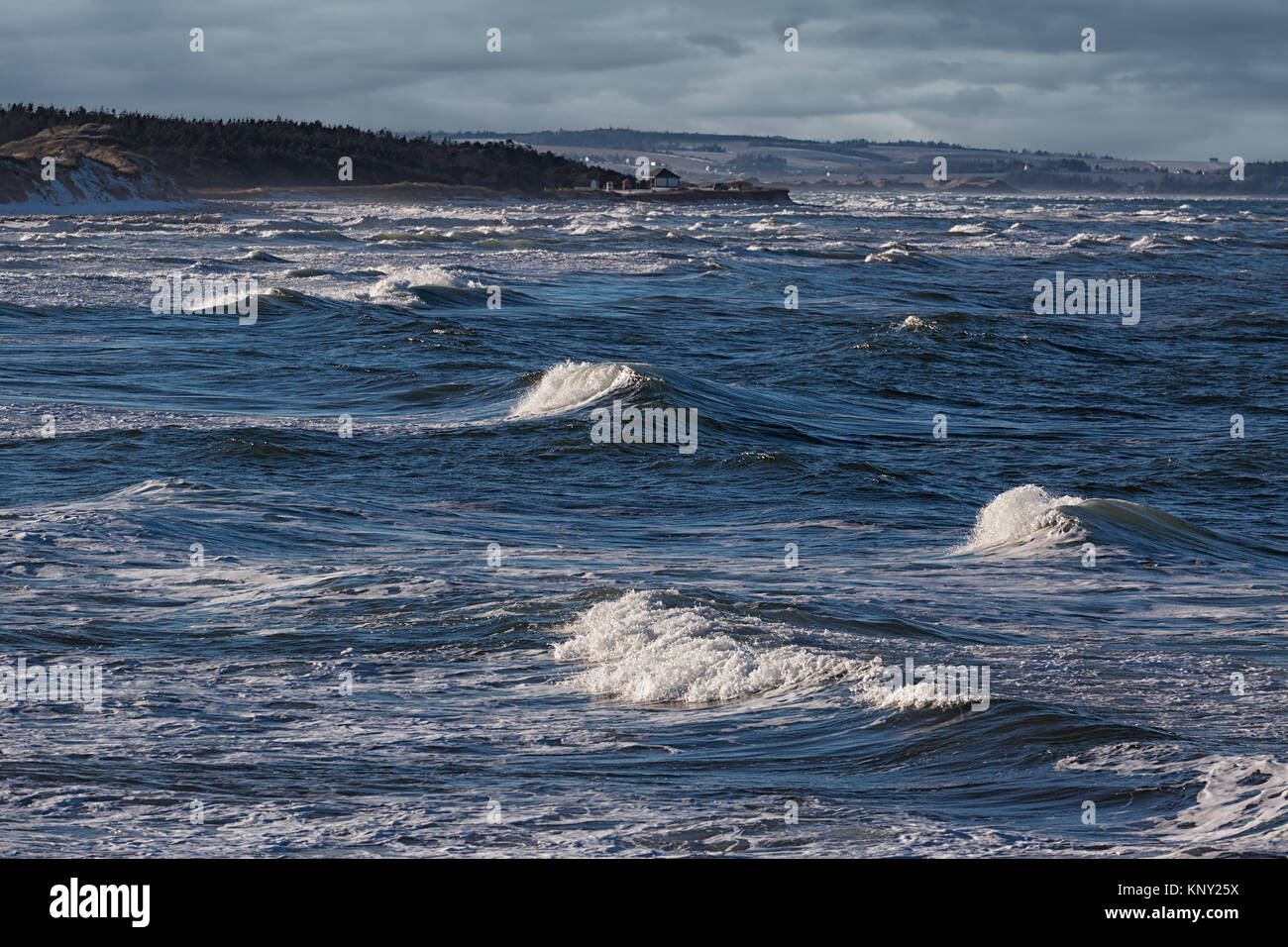 Waves rolling in along the shoreline of Cavendish beach in Prince ...