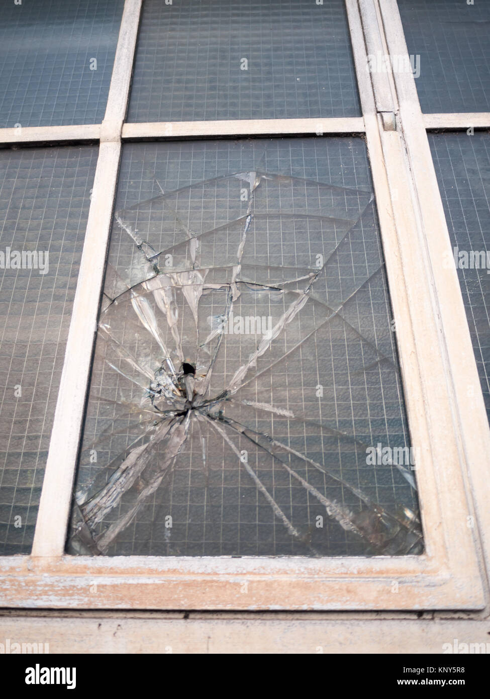 smashed broken window up close criminal damage vandalism crime; essex ...