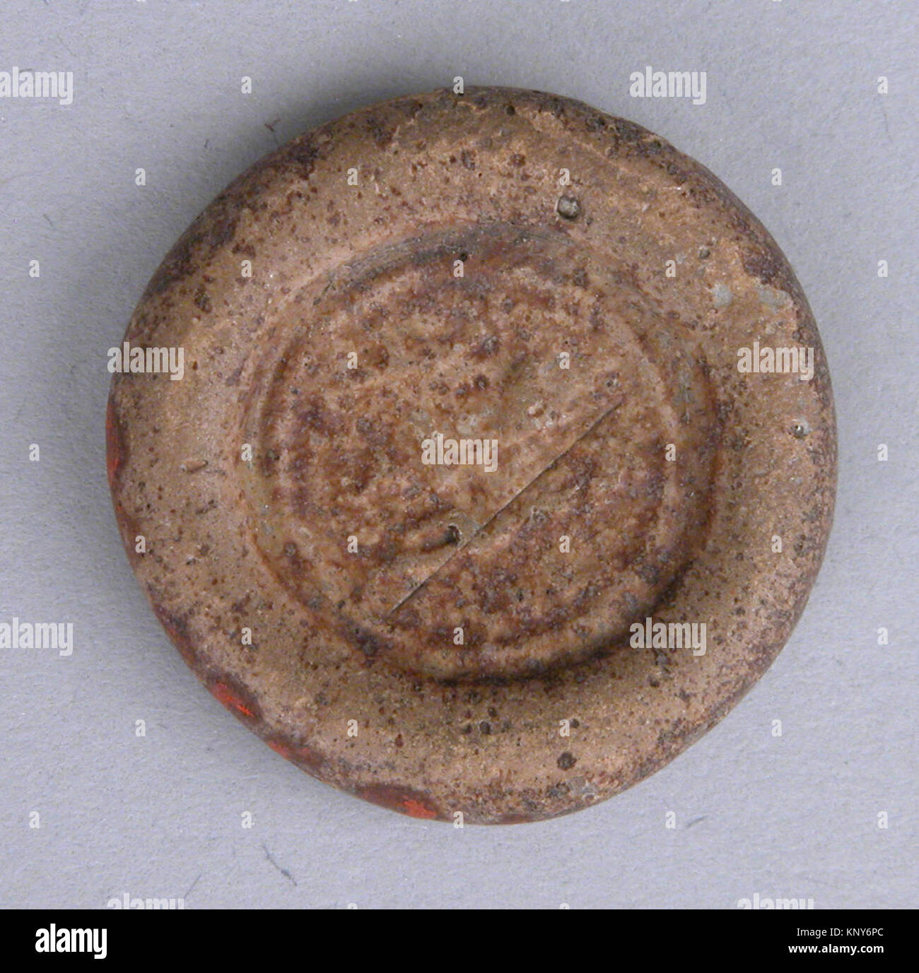 MET sf08-256-24 is a 12th-century Egyptian glass coin weight used to ...