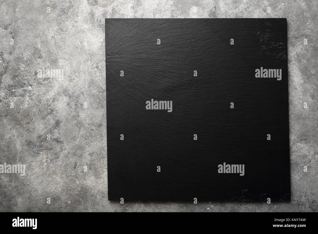 Slate plate on loft background Stock Photo - Alamy