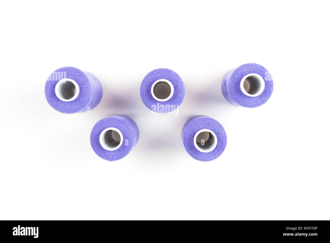 Five purple sewing threads on a white background, sewing and tailoring ...