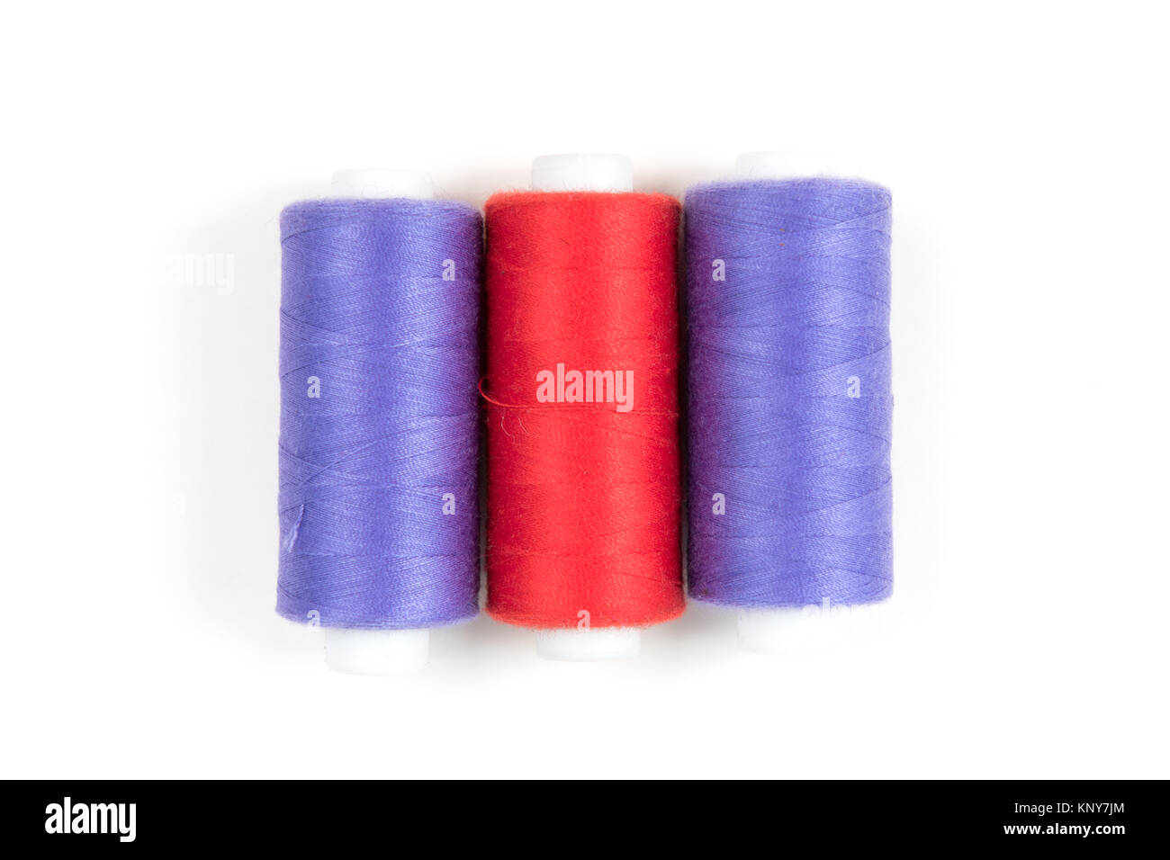 Red and purple sewing threads on a white background. Set of three ...
