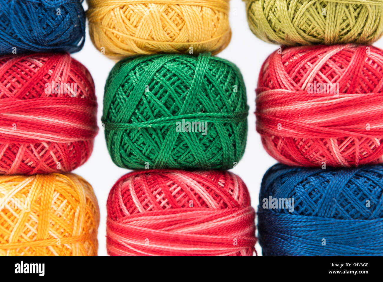 Colorful sewing threads as background or wallpaper Stock Photo - Alamy