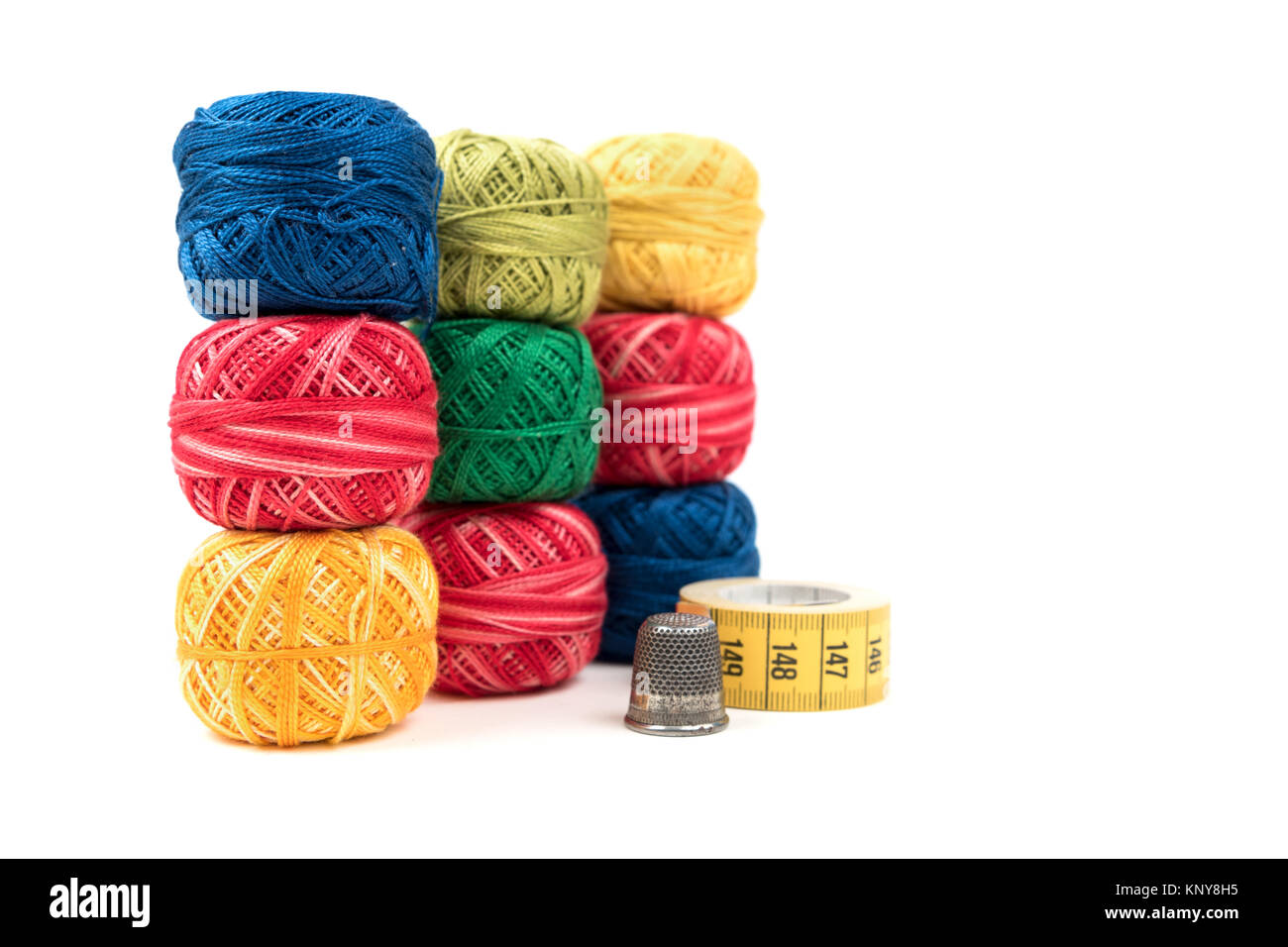 Colorful sewing threads as background or wallpaper Stock Photo - Alamy