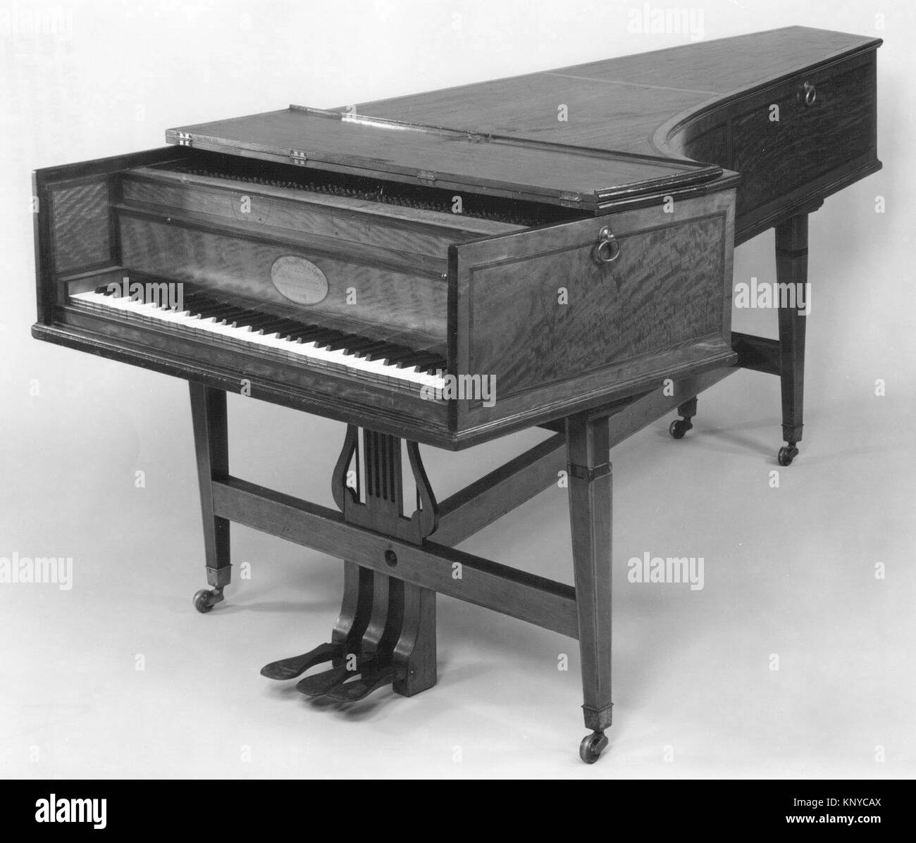 Depiction of a grand piano with keyboard, wooden case, metal frame, and ...