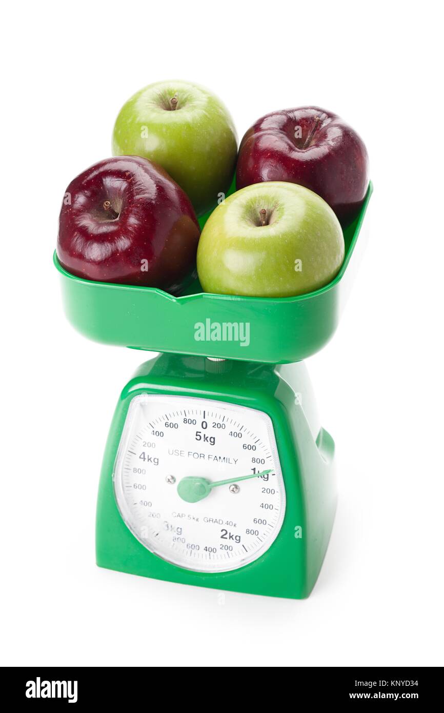 apples on a kitchen food scale Stock Photo - Alamy