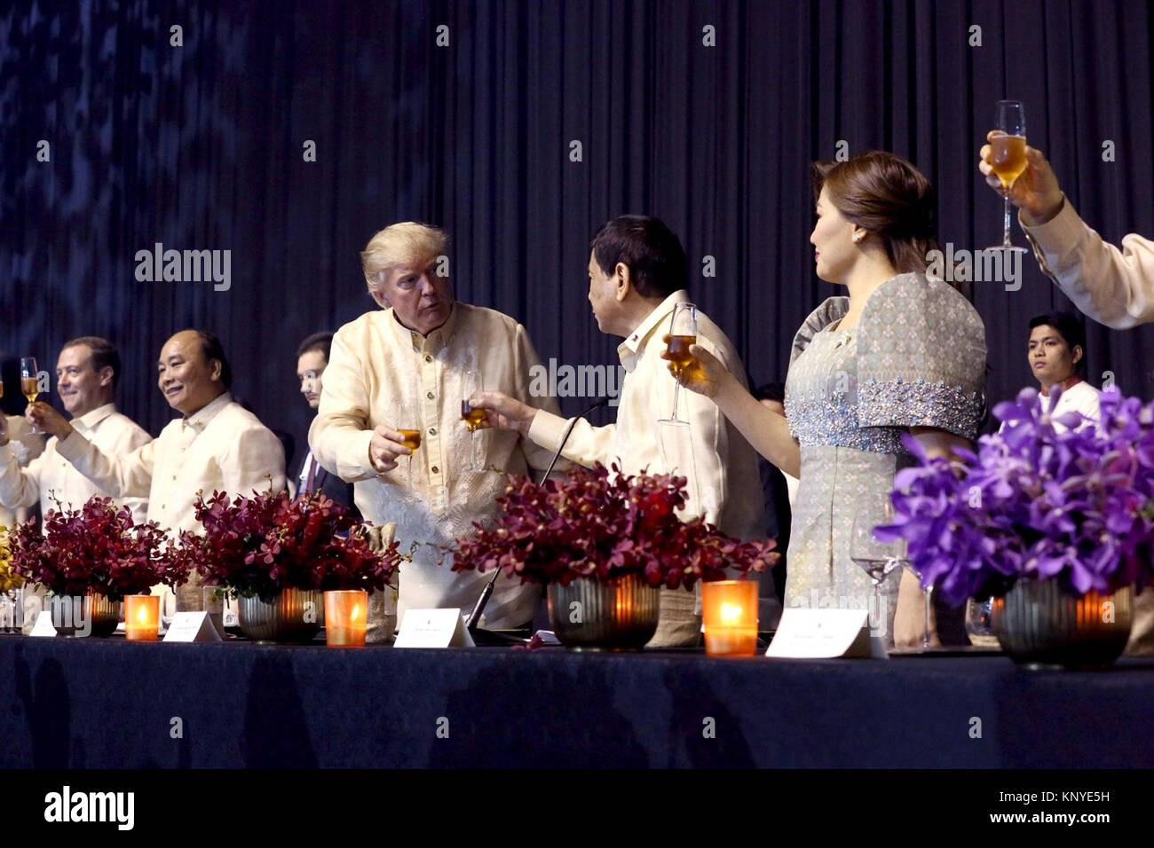 U.S. President Donald Trump, center, toasts with Philippines President ...