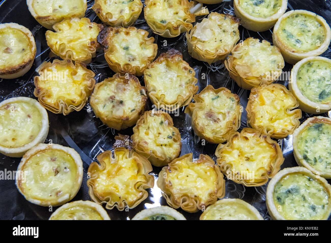 baking mini bite size quiche appetizers Stock Photo - Alamy