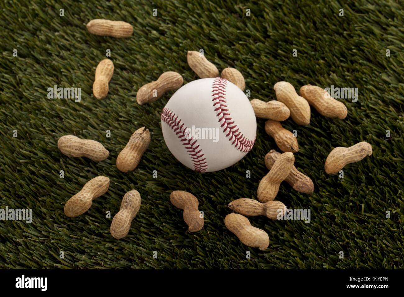 baseball ball surrounded by ground nuts Stock Photo - Alamy