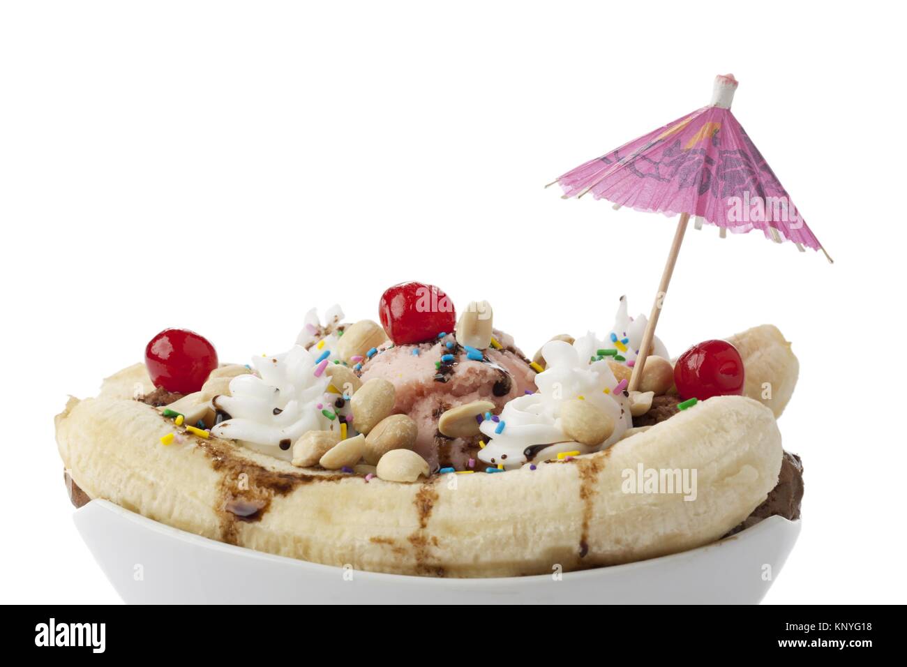 bowl of banana split with little umbrella Stock Photo - Alamy