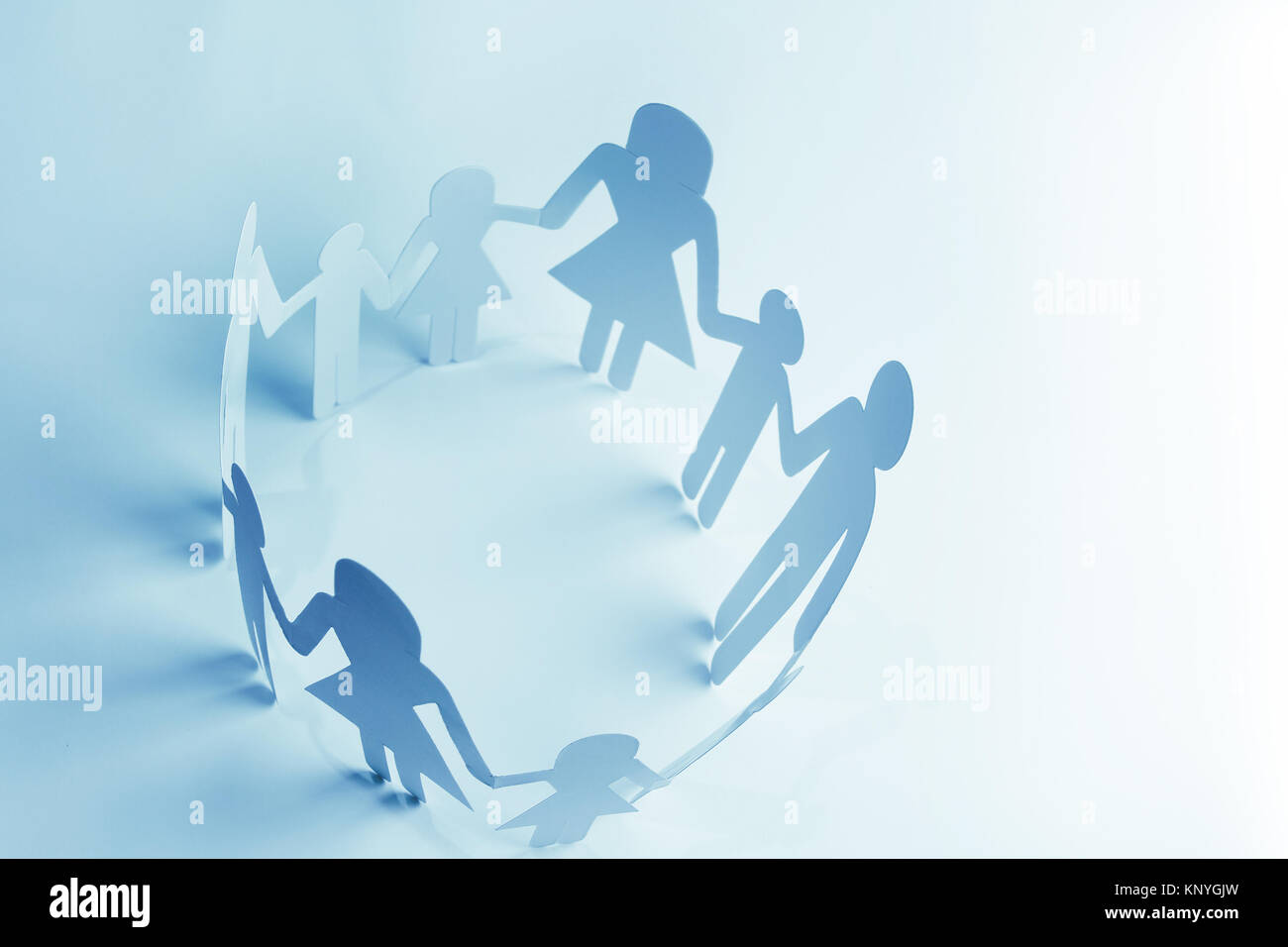 Family paper chain cutout holding hands Stock Photo - Alamy