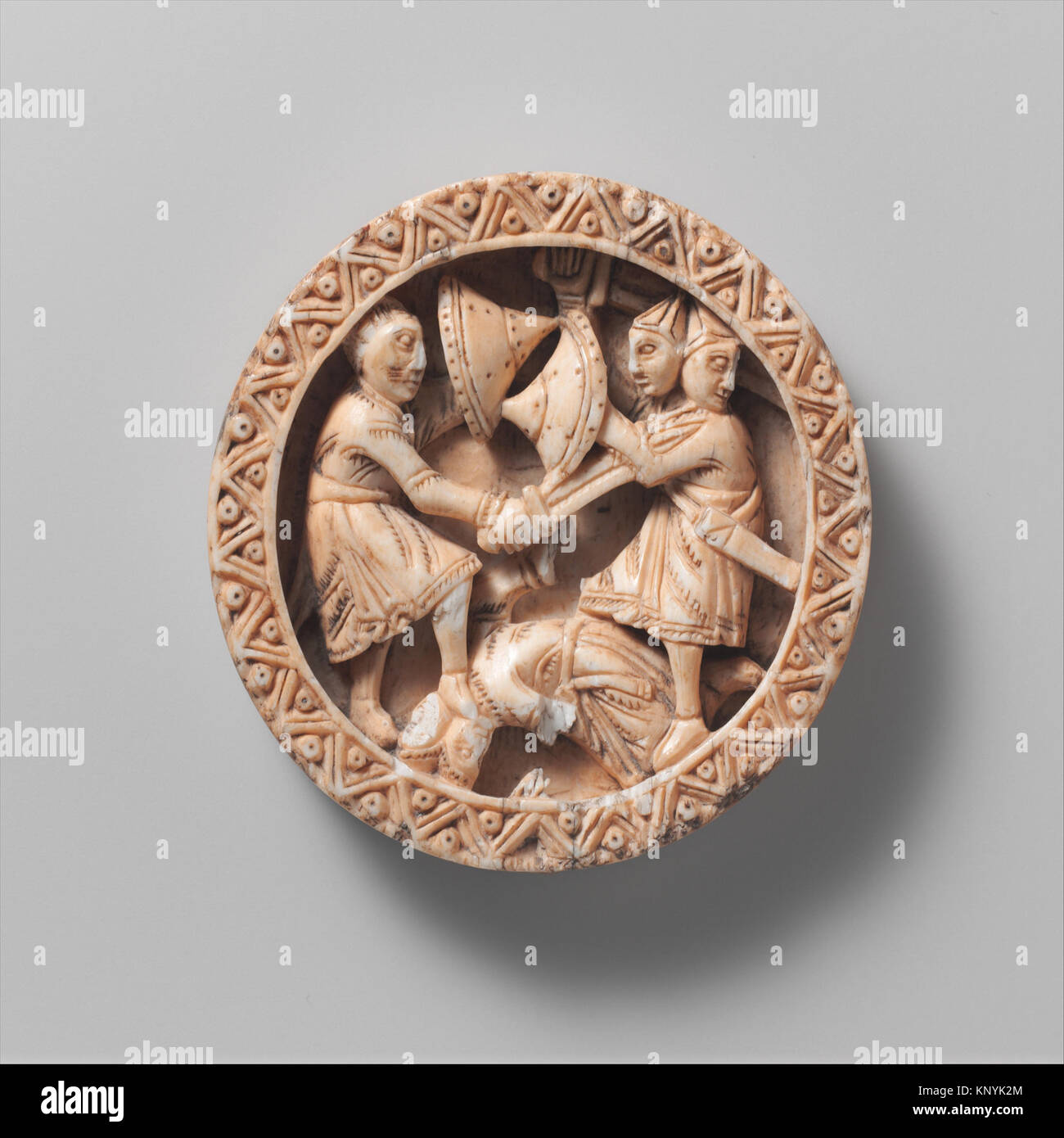 A game piece depicting the mythological hero Hercules slaying the three ...