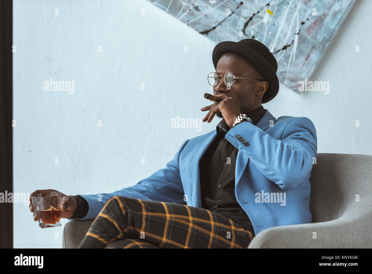 stylish man smoking cigar Stock Photo - Alamy