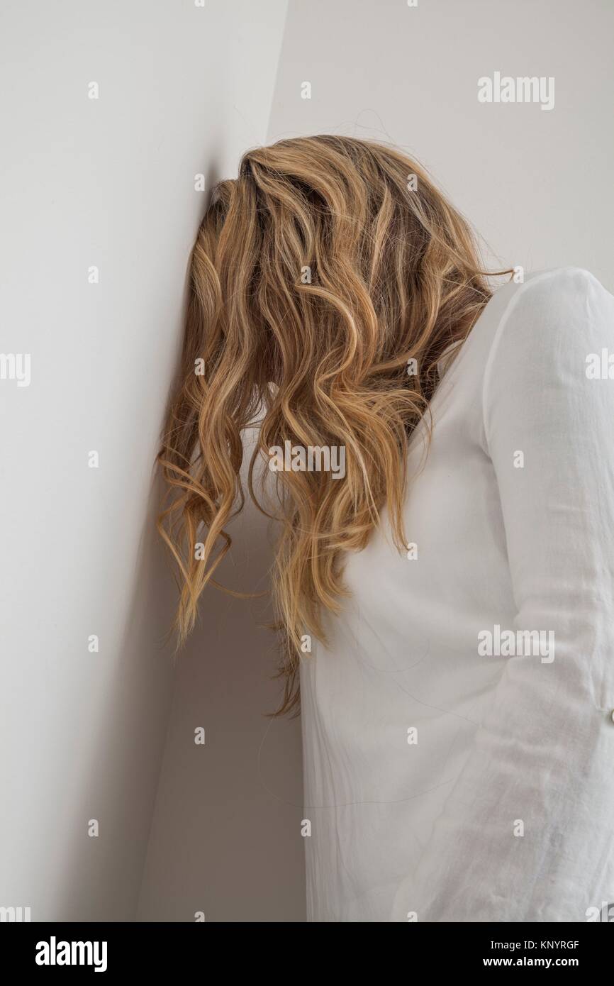 Woman Leaning Head Against Side Stock Photos & Woman Leaning Head ...