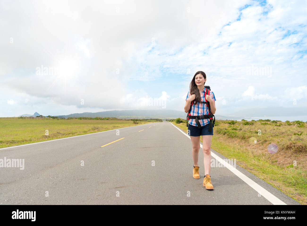 smiling pretty female backpacker enjoying summer holiday travel and ...