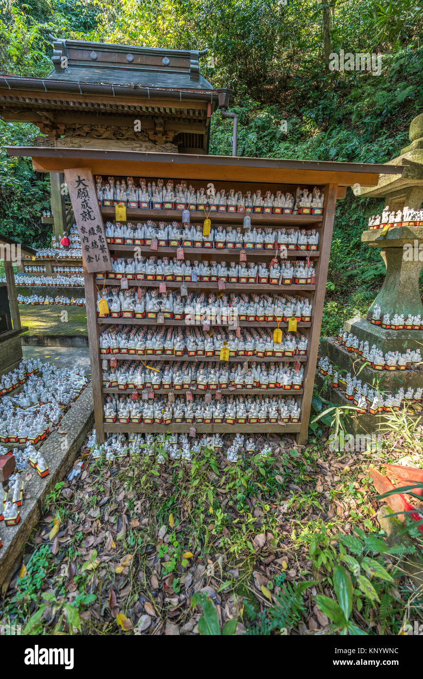 Sasuke Inari jinja. Small Inari statues at upper shrine. founded by ...