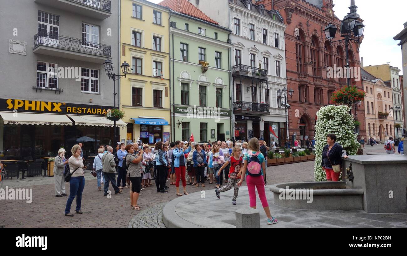 Group of tourists in a tour arounf the polish city of Torun, Poland ...